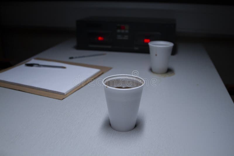 Police Custody Interview Room with Documents and Coffee Cups Stock ...