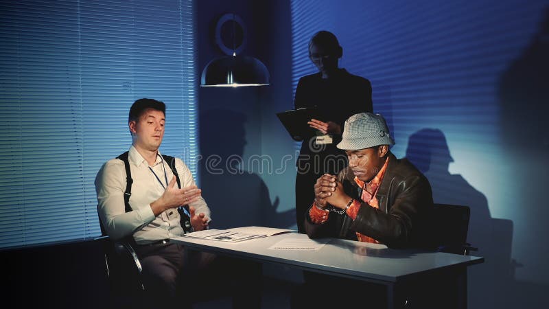 Police Detective Questioning Suspect Black Man in Interrogation Room ...