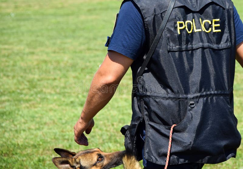 Police man with his dog stock image. Image of patrol - 59513959