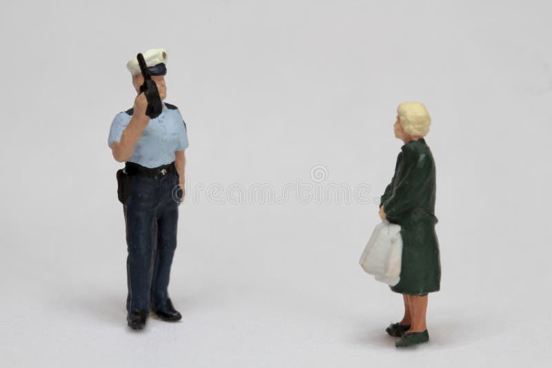 A Police Man with an Old Lady Miniature Figurines Stock Photo - Image ...