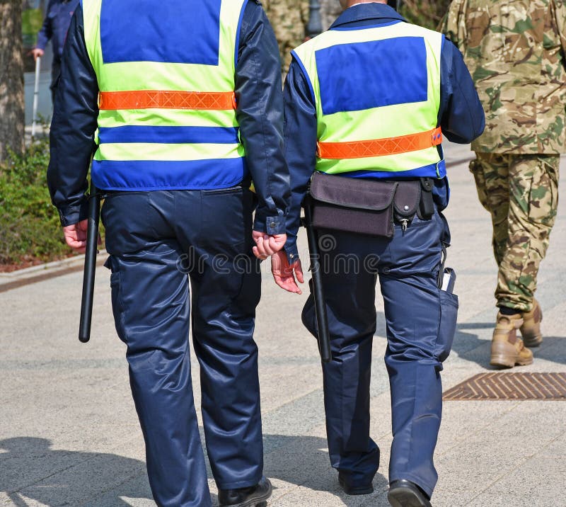 Police men on the street stock photo. Image of camouflage - 144913258