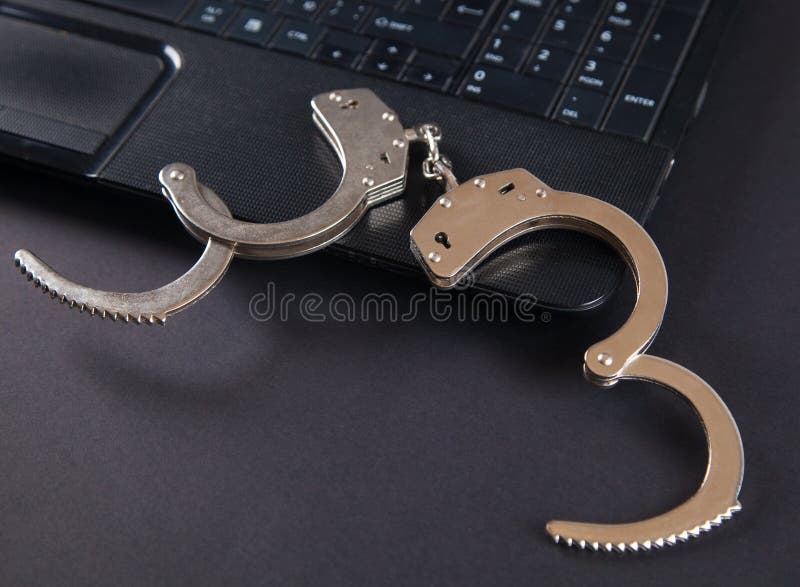 Police Metal Handcuffs and Computer Keyboard Stock Photo - Image of ...
