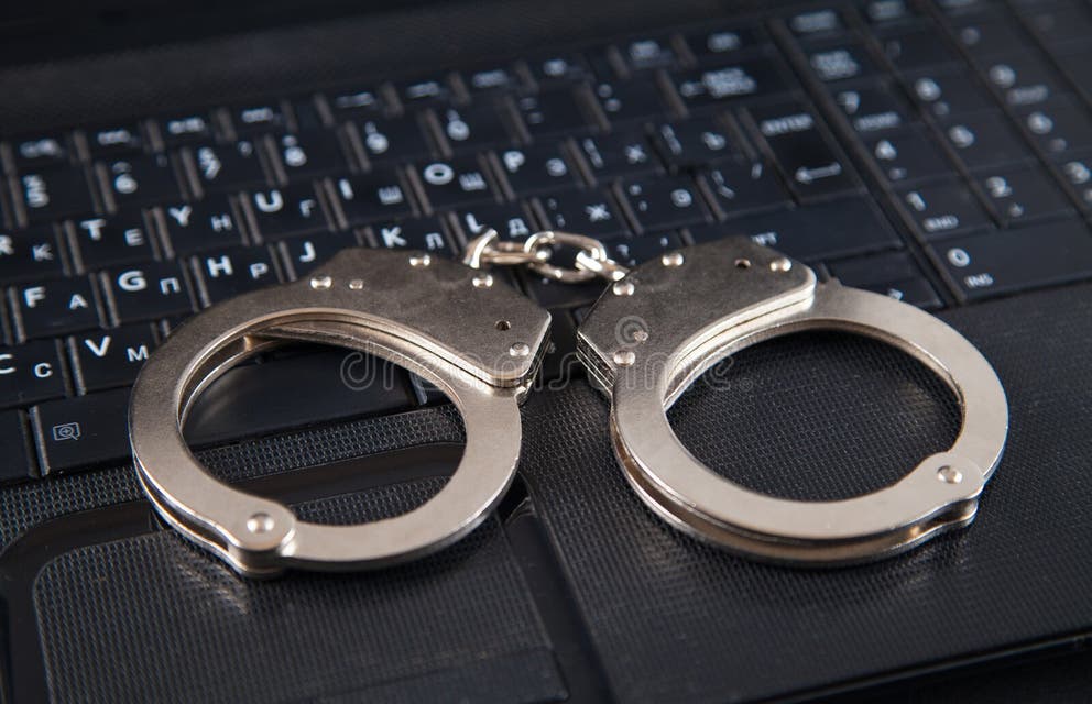 Police Metal Handcuffs and Computer Keyboard Stock Photo - Image of ...