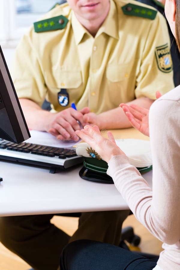 Police Officer in Department Registering Complaint Stock Image - Image ...