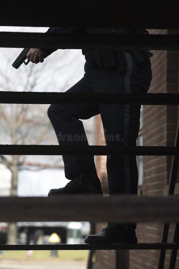 Police Officer with Drawn Pistol Searching. Stock Photo - Image of ...