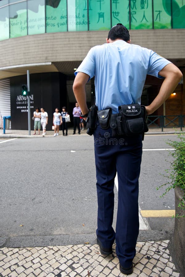 Police officer patrolling editorial image. Image of macanese - 44467340