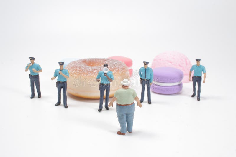 A Police Officer Stops a Fat Man from Reaching the Dessert Stock Photo ...