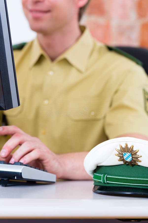 Police Officer Working on Desk in Station Stock Photo - Image of ...