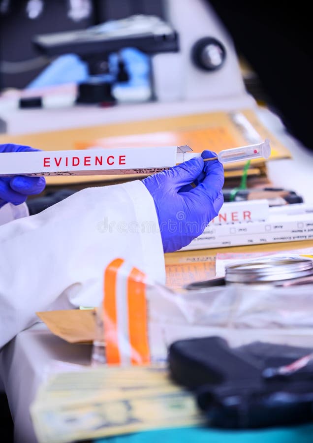 Police Scientist Pulls Out Isope with Sample of Evidence Implicated in ...