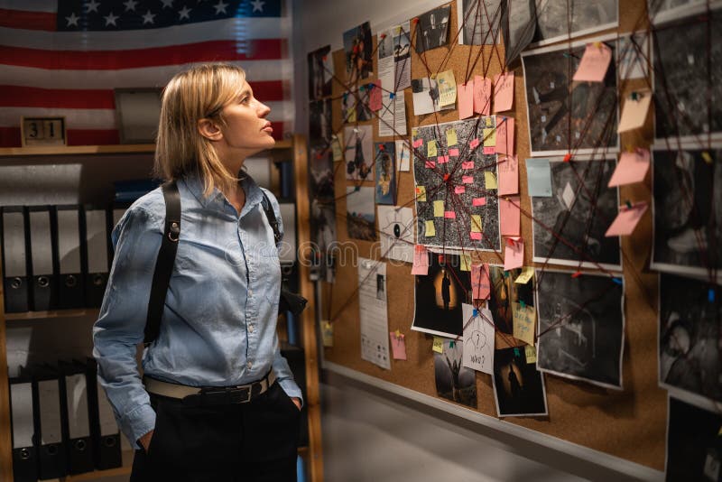 Policeman Analyzing Information of Crime on Investigation Board ...