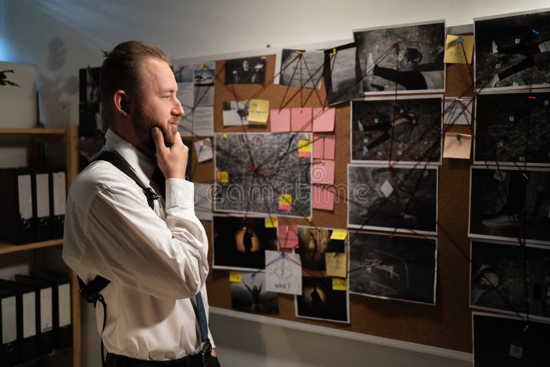 Policeman Analyzing Information of Crime on Investigation Board ...