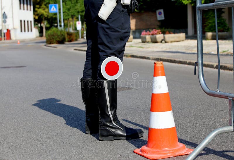 Policeman with the Paddle while Directing Traffic Stock Image - Image ...