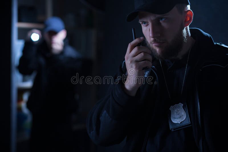 Policeman Calling for Back Up Stock Photo - Image of face, calling ...