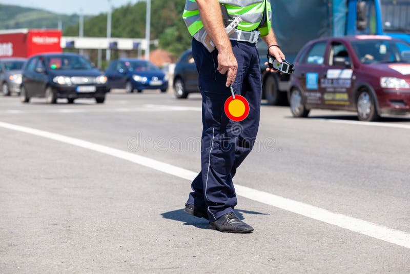 Police Officer Controlling Traffic on the Highway Stock Image - Image ...