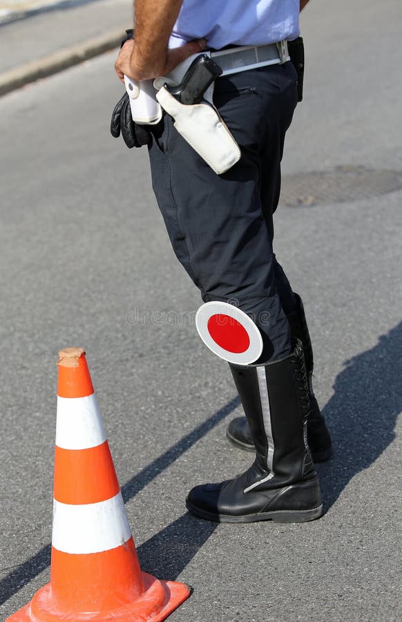 Policeman with the Paddle while Directing Traffic Stock Image - Image ...