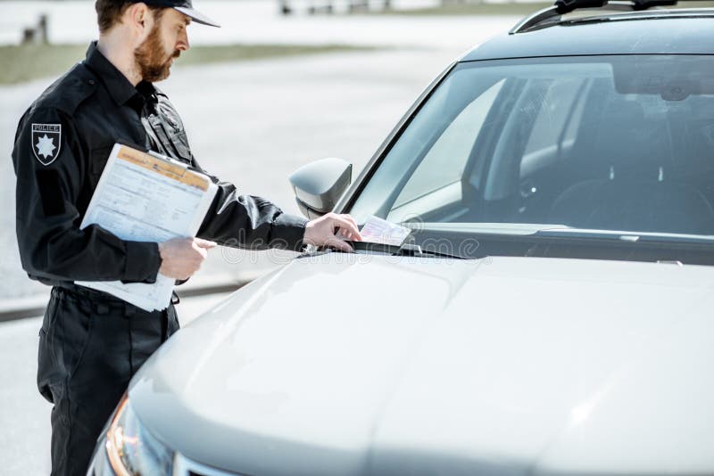Policeman Putting Fine on the Car Stock Image - Image of professional ...