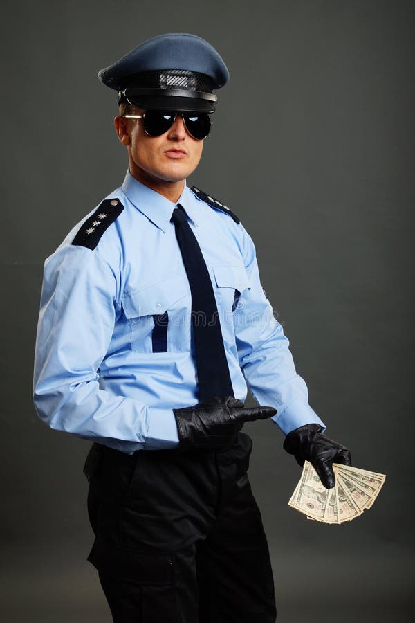 Policeman with money stock photo. Image of muscular, police - 65652870