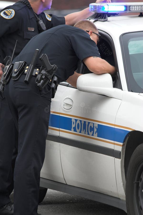 Policeman talking 2 stock photo. Image of jail, people - 1183698
