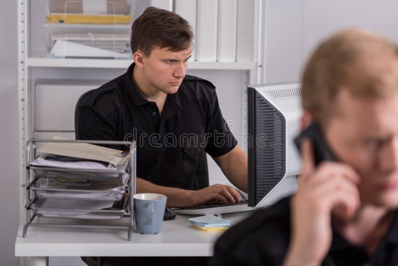 Policeman Using Computer at Work Stock Photo - Image of station ...