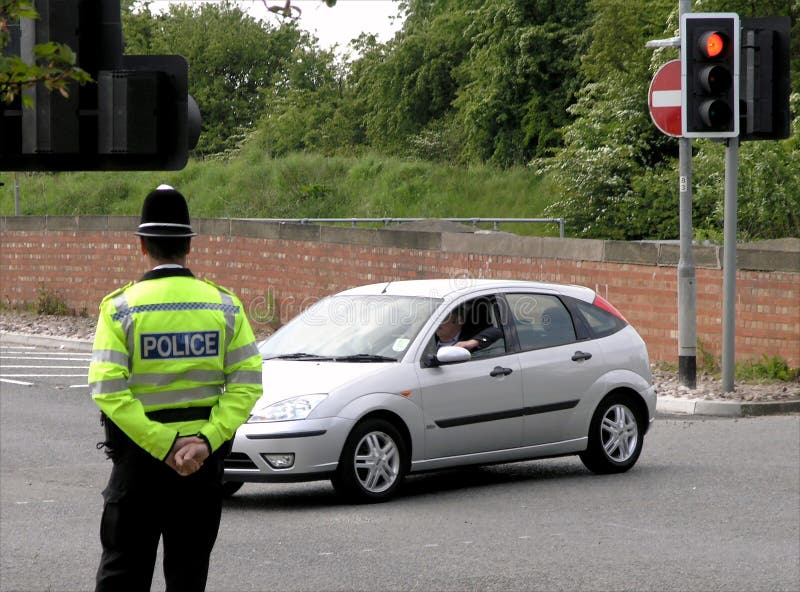 Policeman watching traffic stock image. Image of driving - 123907