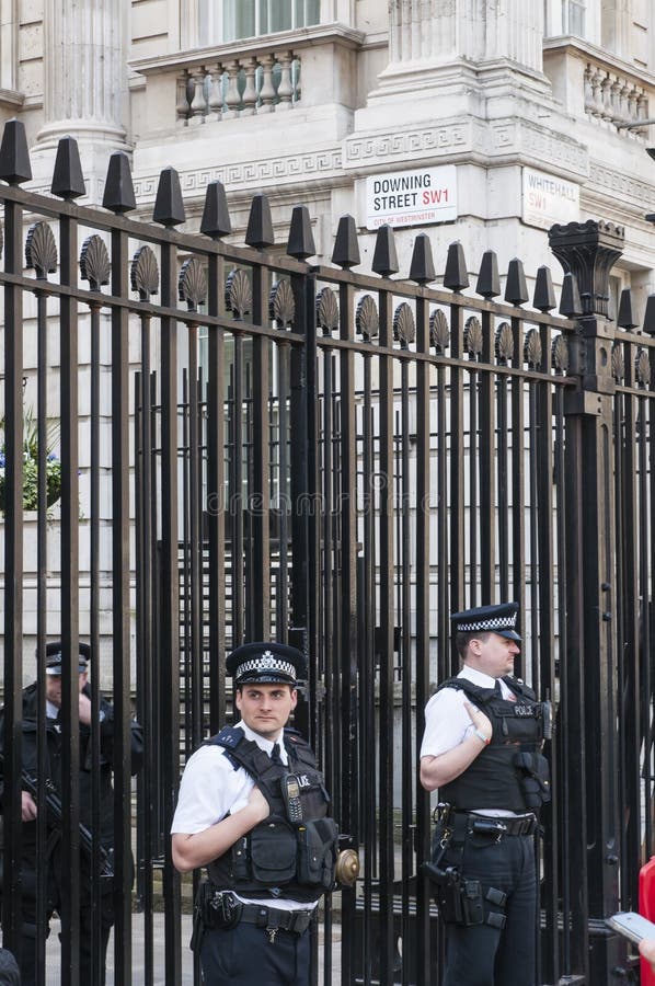 A Police Officer Guards the Entrance Door of 10 Downing Street in ...