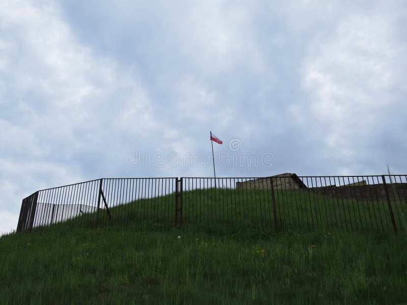 Polish Flag in Wind on a Tower of Stronghold with Clouds in Background ...