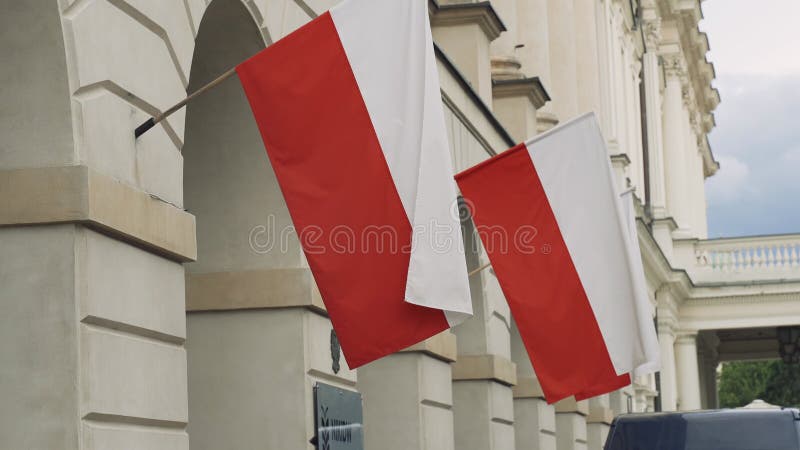 Polish Flags Flutter in the Wind Against a Building in the City Center ...