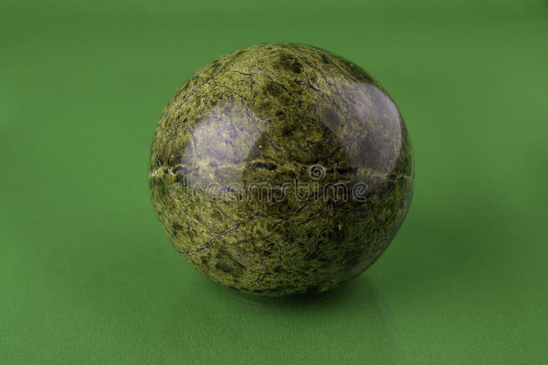 Polished Green Stone Sphere on a Reflective Surface Stock Photo - Image ...