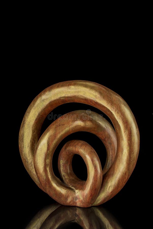 Polished, Painted Gold Loop Abstract Sculpture in Black Stock Photo ...
