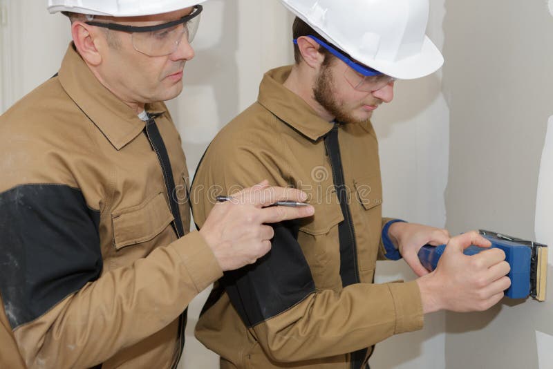 Polishing the filled wall stock image. Image of stroke - 122042527