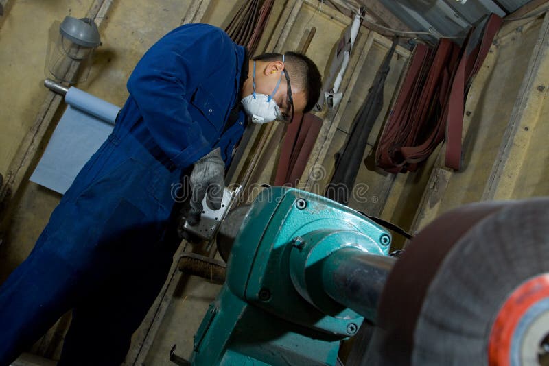 Polishing Metal in Workshop Stock Photo - Image of polishing, hand: 9927988