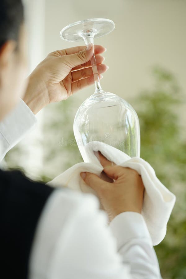 Polishing Stemware in Bright Kitchen Setting Stock Image - Image of ...