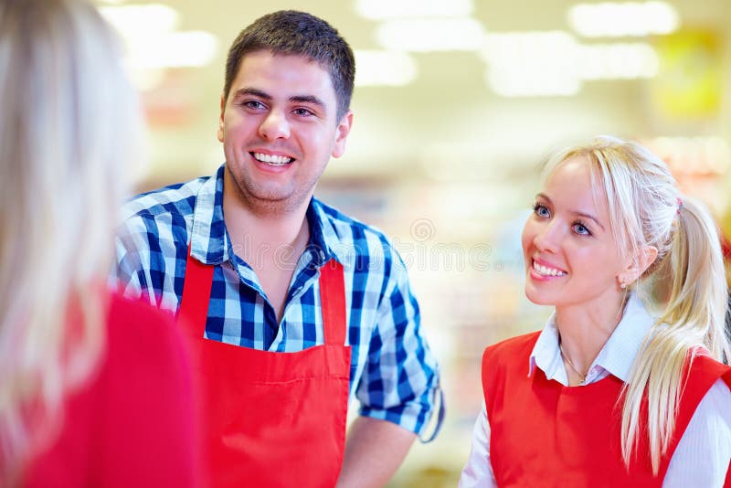 Polite Grocery Staff Serves Customer in the Mall Stock Image - Image of ...