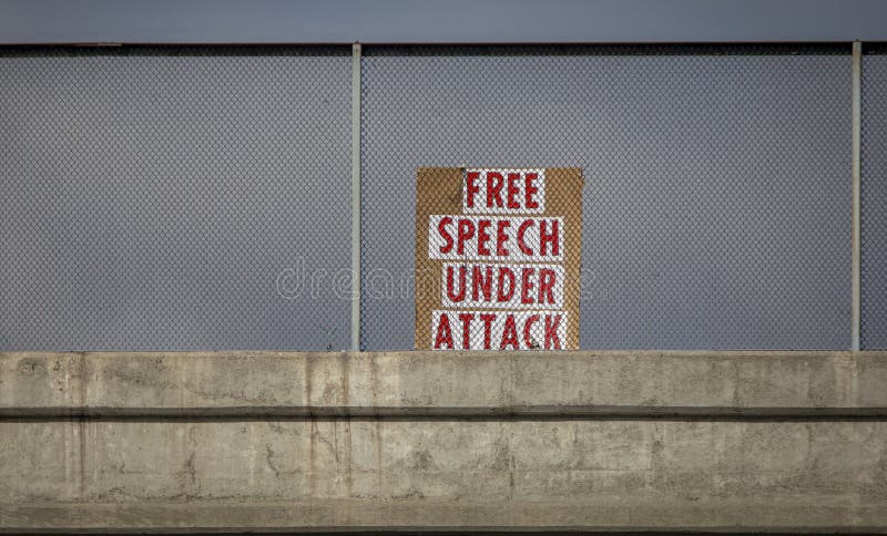 Political Protest Sign Stating Free Speech Under Attack on a Freeway ...