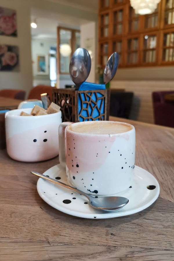 A Polka Dot Cup Sits on a Wooden Table. the Cafe Atmosphere with ...