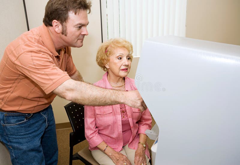 Poll Worker Assists Sr. Voter Stock Image - Image of person, explaining ...