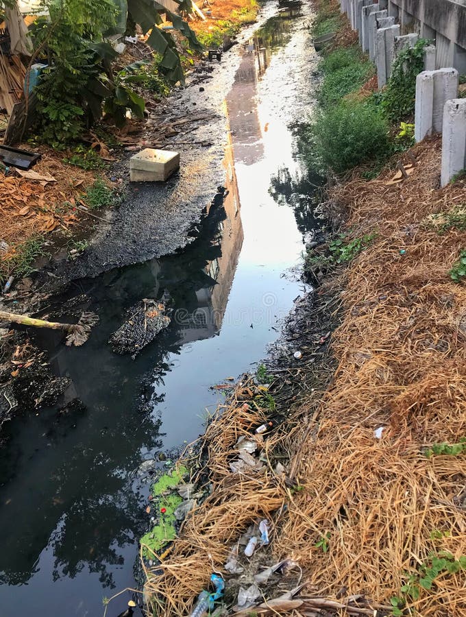 Dirty Polluted Waste Water In Big City With Garbages. Environment ...