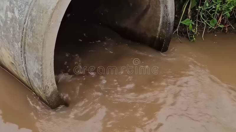 Polluted Water Flowing from Concrete Pipe into River Stock Video ...
