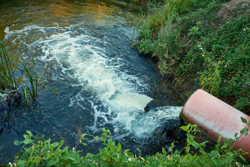 Polluted Water Flows from a Large Drainage Pipe into a Natural River ...