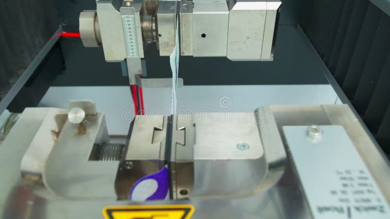 Polymer Thread Sample Tape is Tested for Strength in Slow Motion Stock ...