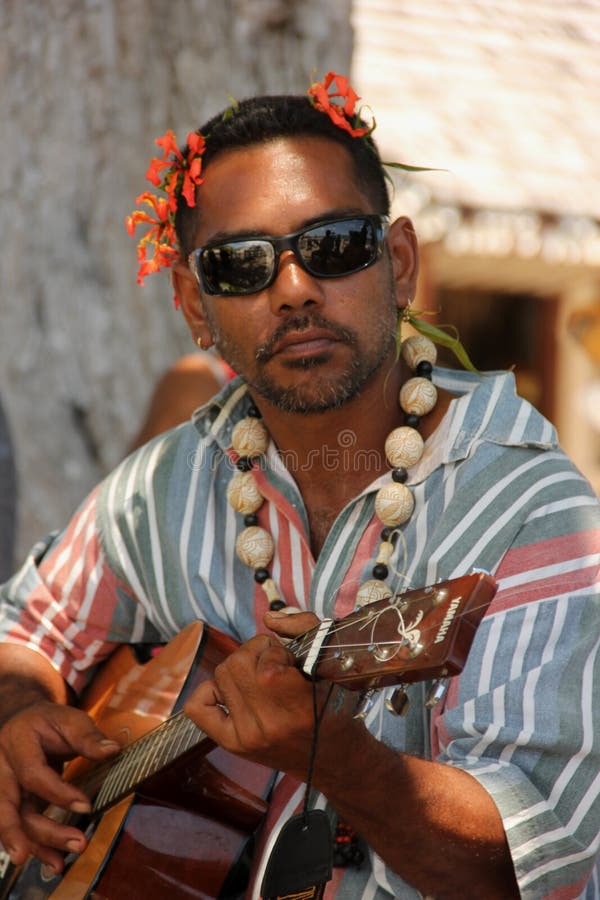 Polynesian Man Playing Shell and Ukulele on Bora Bora Island Beach and ...