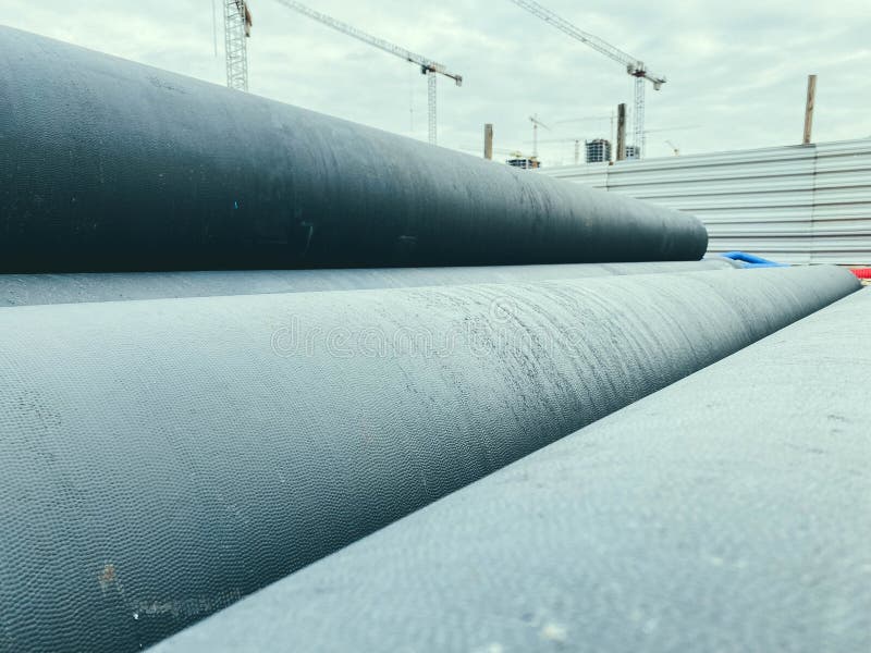 Polypropylene Pipes Made of Black Material Lie on a Construction Site ...