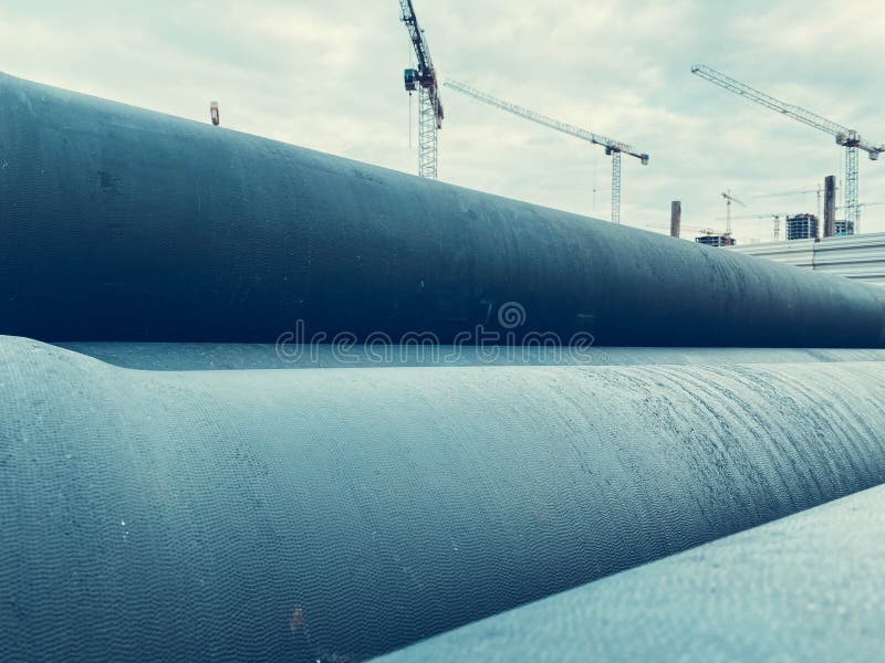 Polypropylene Pipes Made of Black Material Lie on a Construction Site ...