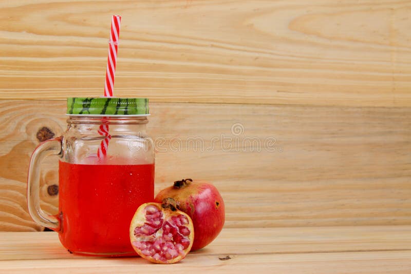 Pomegranate Juice in Vintage Mason Jar with Red Straw Stock Image ...
