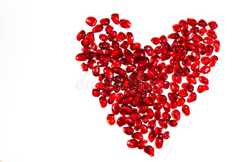 Pomegranate Seeds in a Juicy Red Shell on a White Background. Stock ...