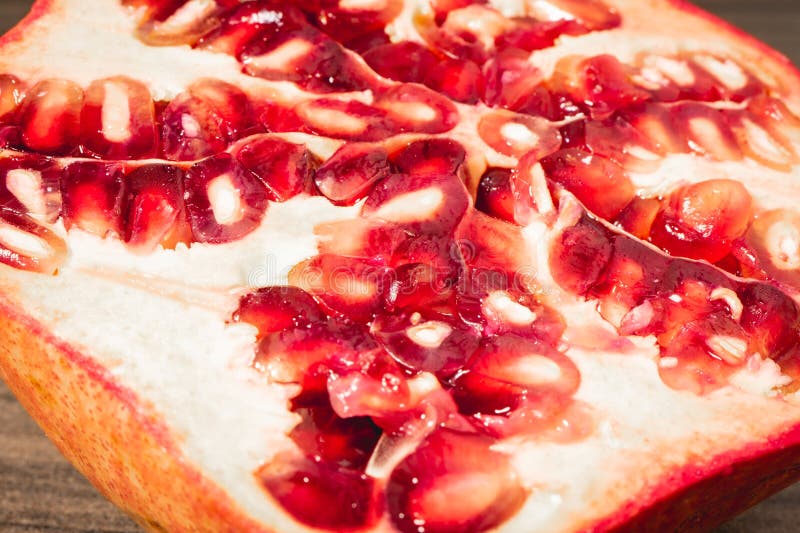 Pomegrenades Cut in Half on a Wooden Background Stock Photo - Image of ...