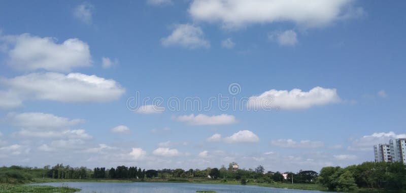 Pond and Blue Sky and Cloud and Apartment. Stock Photo - Image of field ...