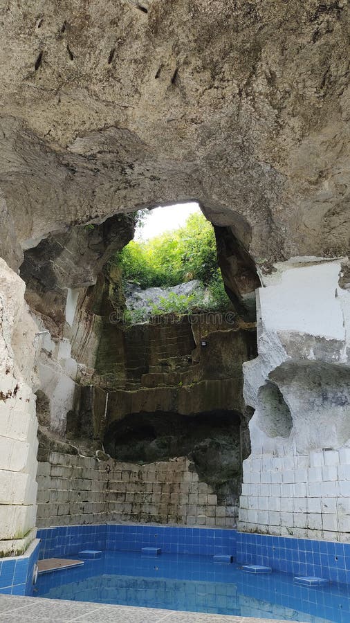 Pond into a cave stock image. Image of swimming, bath - 1552979