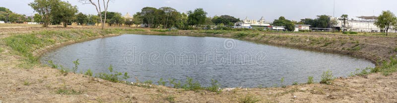 Pond with High Grass and an Empty Field. Empty Field from a Farm Which ...