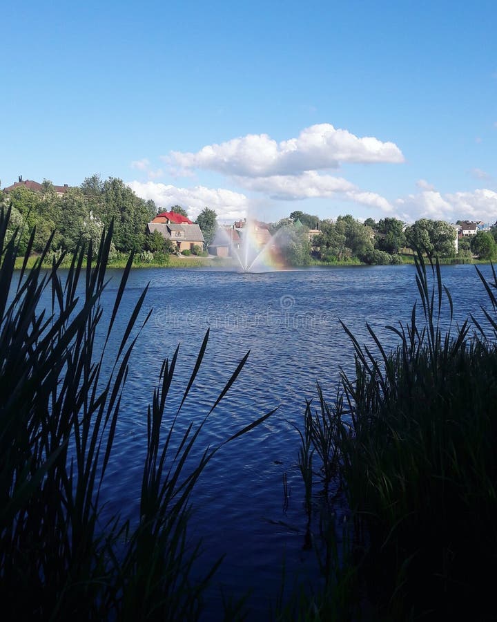 Pond with rainbow stock photo. Image of summer, blue - 153583988